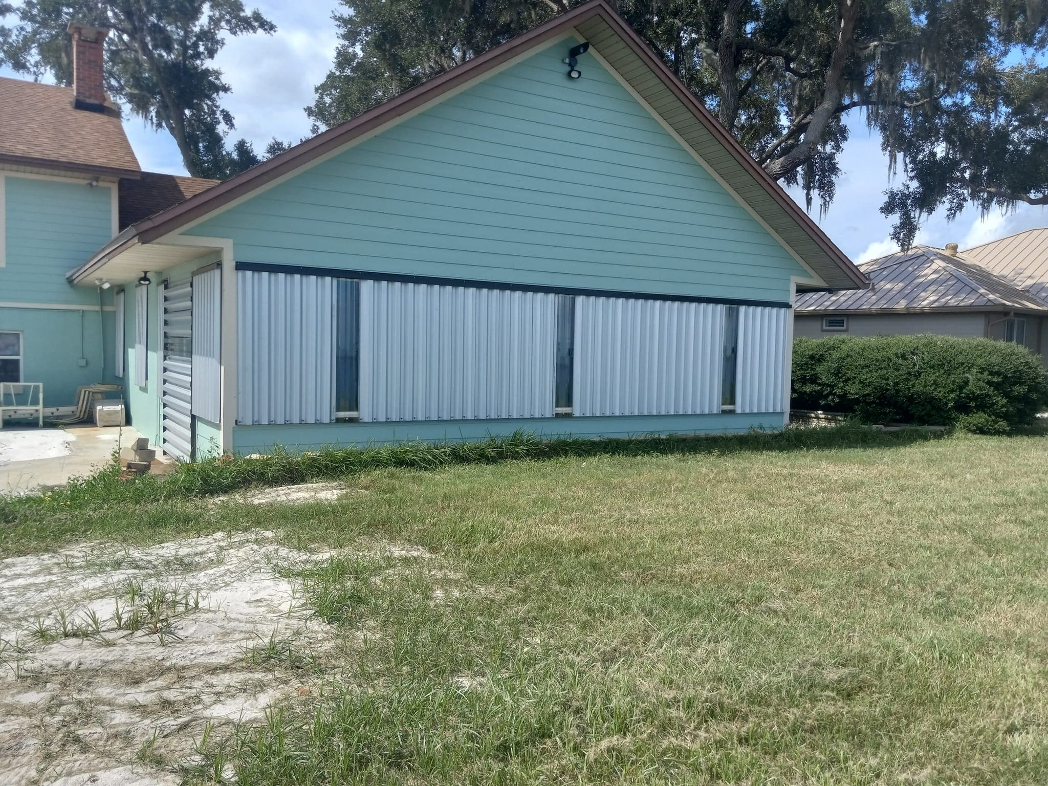 Hurricane Shutter Installation Services | Well Hung LLC